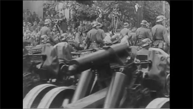 1940s: Platoons of soldiers march. Hitler watches soldiers march ...