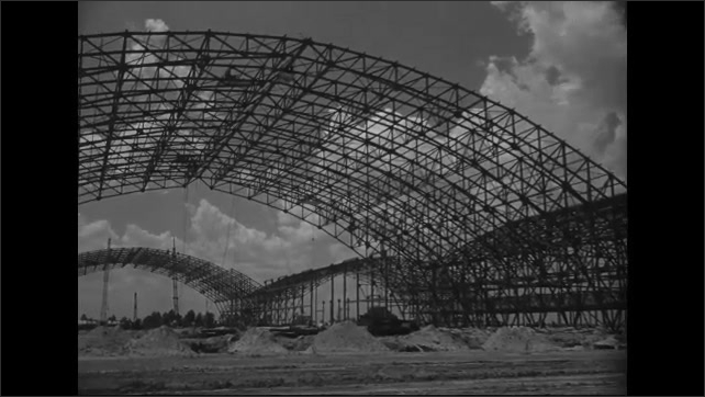 1940s: Steel frames of airplane hangers under construction ...