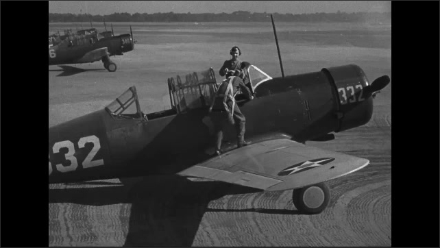 1940s: Pilot starts an airplane engine. Pilot steps out of the rear ...