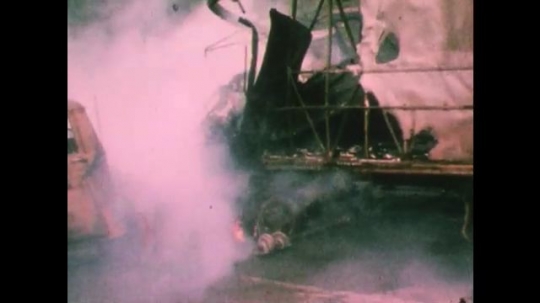 United States: 1950s: Vehicles moved after crash. Smoke around vehicles ...