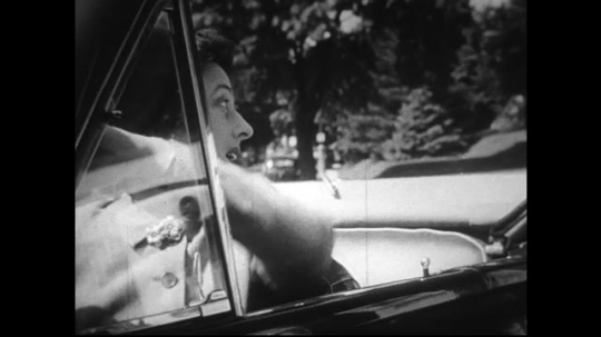 UNITED STATES 1950s : A woman in a convertible speaks to gas station ...
