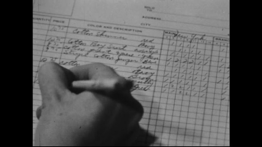 AMERICA: 1950s: A man writes in a ledger. An early computer display ...