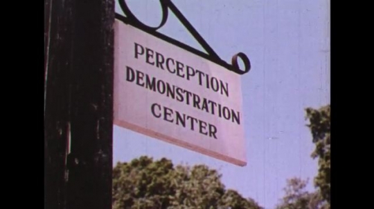 UNITED STATES: 1950s: Sign on wall for perception demonstration centre ...
