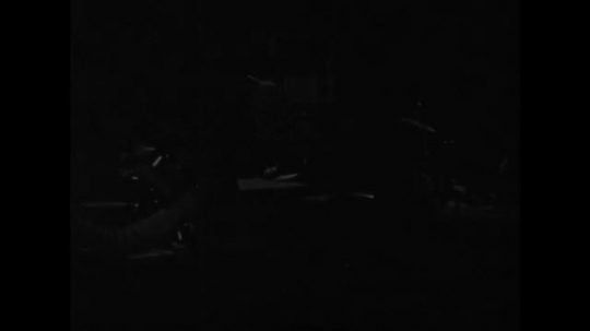 UNITED STATES: 1950s: Students work in science lab. Boy looks around ...