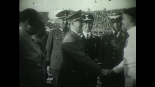 BERLIN 1936: Hitler shakes hands with an Olympic competitor. Olympic ...