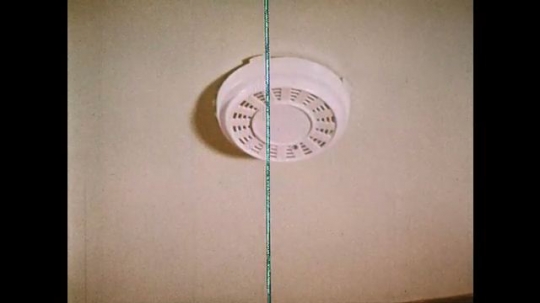 1970s: Smoke detector. Superhero talking. – Archival Footage