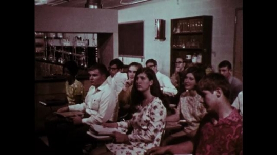 1970s: Students leave desks. Students enter science laboratory ...