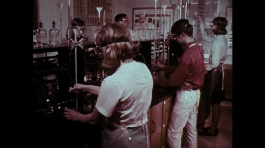 1970s: Students work at laboratory tables. – Archival Footage