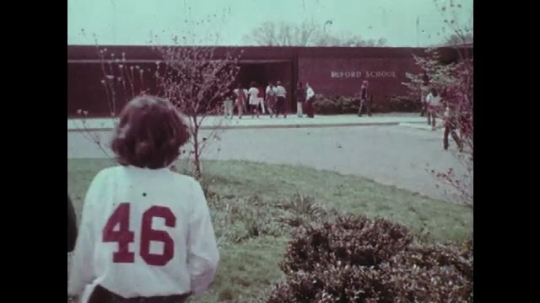 1970s: UNITED STATES: students arrive at school. Students enter ...