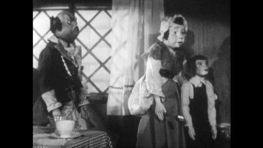 1940s: Puppet family stands together in kitchen, piper puppet walks to ...