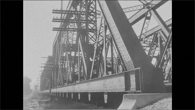 1940s: Steam train powers through trestle railroad bridges. – Archival ...