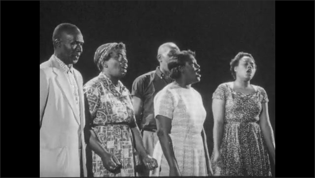 1960s: UNITED STATES: choir sings on stage. – Archival Footage