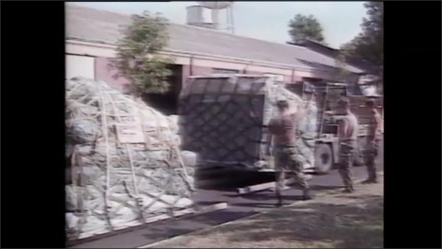 2000s: Soldiers in camouflage uniforms inspecting luggage. Essential ...