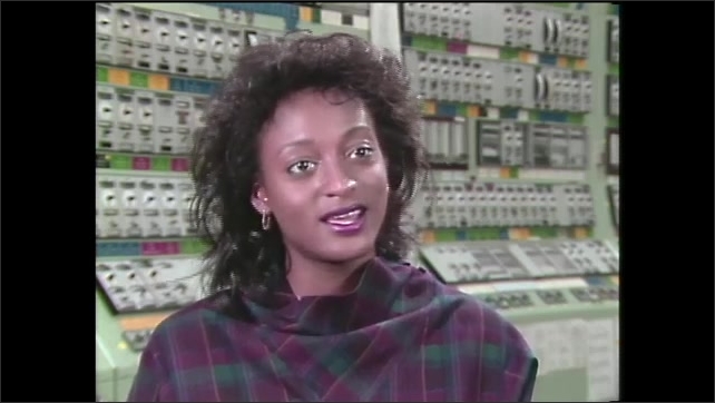 1990s: Woman talks in engineering lab. Girl talks on playground ...