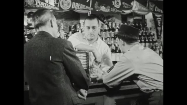 1940s: Young soldier converses with bartender, man at bar; soldier ...