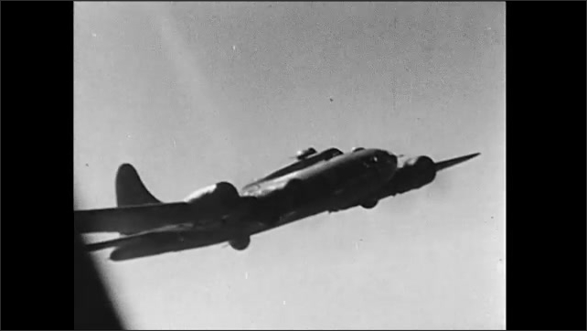1940s: pilot in cockpit talks, puts on oxygen mask, military plane with ...