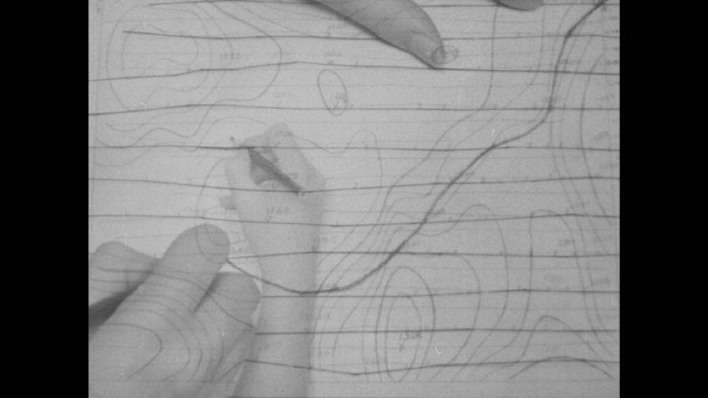 UNITED STATES 1950s: hand draws line on topographic map. woman draws ...
