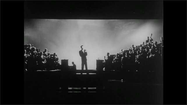 1940s: Stage. Frank Sinatra performs with orchestra. – Archival Footage