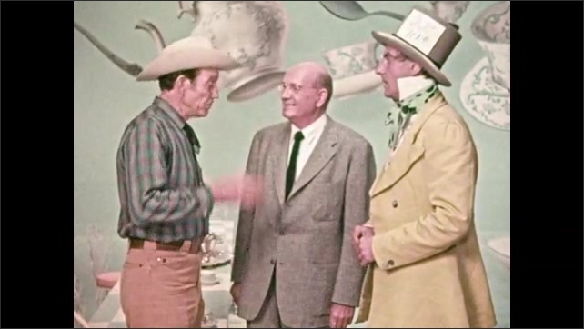 1950s: Professor smiles, talks to Mad Hatter who looks shocked. Man in ...