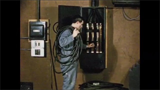 1950s: Mother and Father do the dinner dishes and talk as boy watches ...