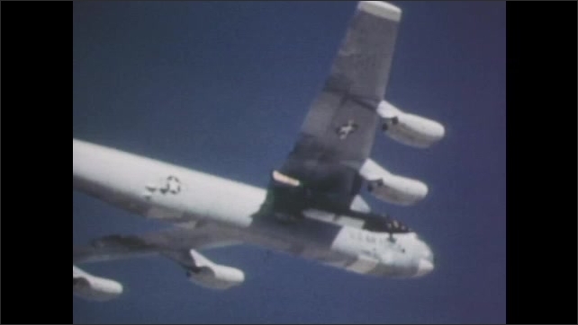 1960s: Lifting body aircraft lands. Men crowd around lifting body ...