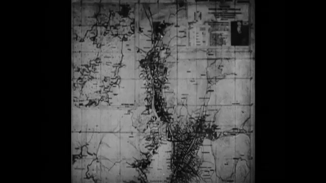 Japan 1940s: Map of Nagasaki. Arrows point to the north and south, and ...