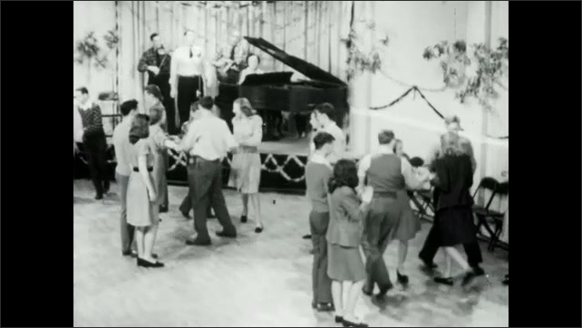 1940s: Couple peaks behind another couple. Both couples swing. Circle ...