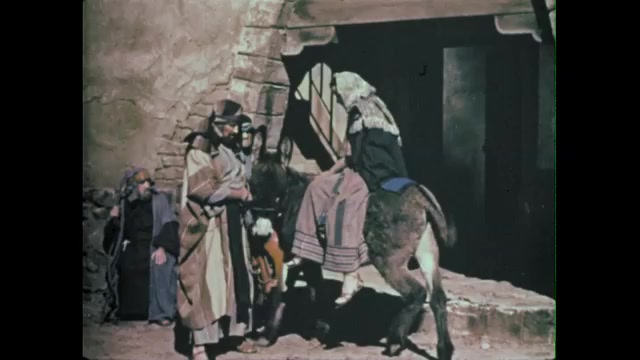 00 AD: Innkeeper walks away with Joseph, Mary and donkey. Man ties up ...