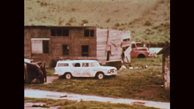 1970s: car exploding in front of run-down wooden building, different ...