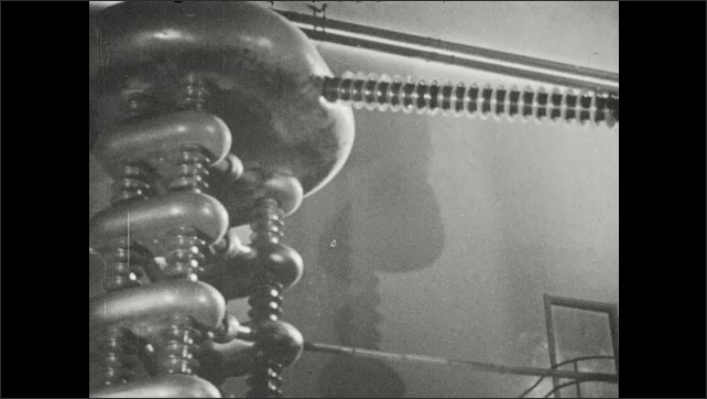 1940s: Large electrode towers and tubes stand in particle acceleration ...