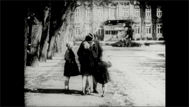 1930s: Adolf Hitler sitting in car. Men driving in car. Man walking on ...