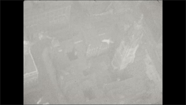 1920s: The underside of a blimp. Blimp pilot in his cockpit. Overhead ...
