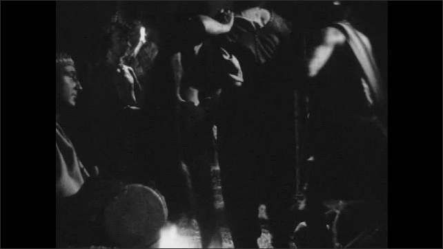 1950s: UNITED STATES: man tied up with rope. Indian tribe capture man ...