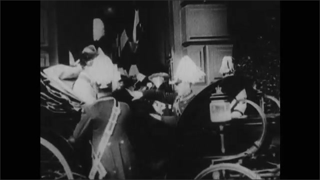 1910s: Two men in tall hats with tassels board horse drawn carriage ...