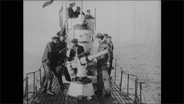 1910s: Cannons fire on battleship in ocean. Cannons fire on battleship ...
