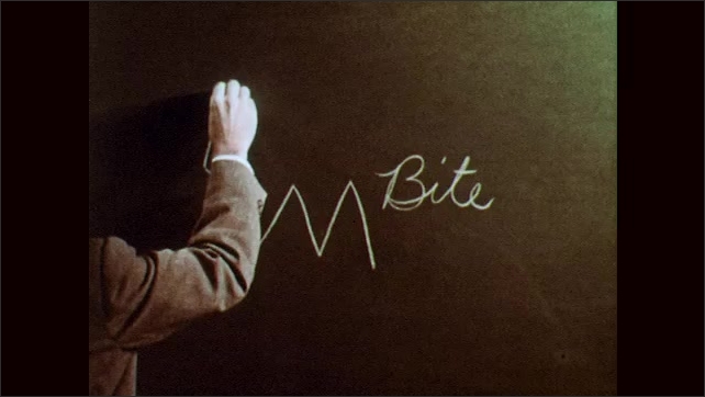 1950s: Man draws diagram on chalkboard: serrations, the word “bite ...