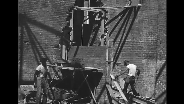 UNITED STATES 1950s: Workers Sit on Steel Girders as they Work at ...