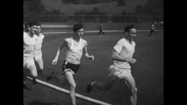 1940s: Group of people run on track. Back of man running on – Archival ...