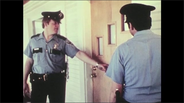 1970s: UNITED STATES: view of house from road. Photograph of police ...