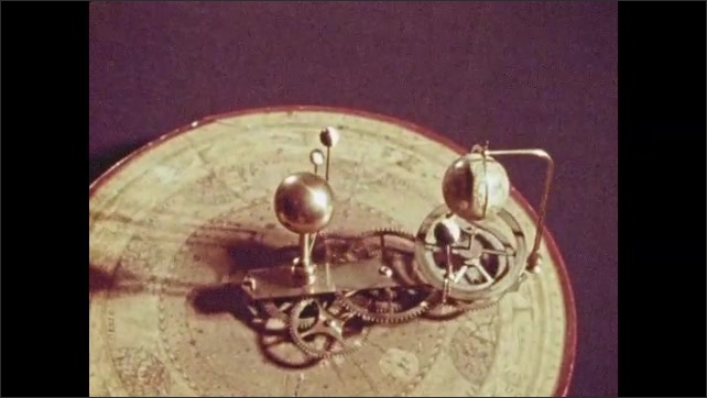 1960s: Model of earth revolves around model of sun. Sun. – Archival Footage