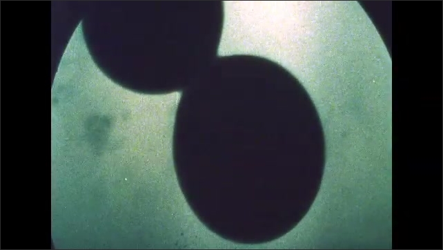 1960s: UNITED STATES: spherical particles on latex. Operator takes ...