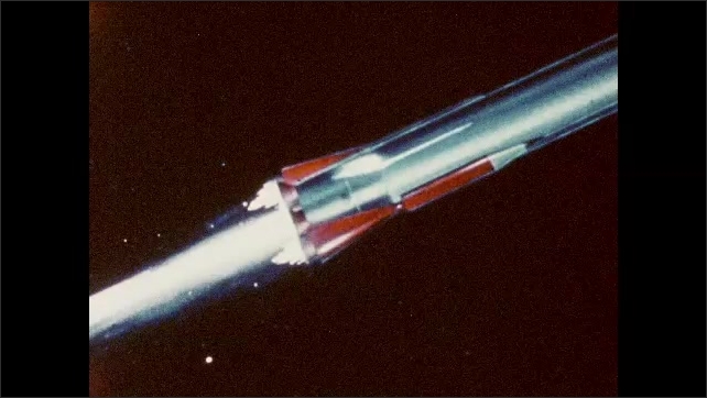 1960s: UNITED STATES: astronaut inside cabin. Animation of rocket ...