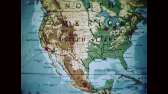 1950s: UNITED STATES: hand points to map. Island on map. South America ...