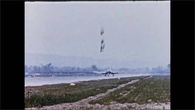1950s: Pilot pilots jet down runway. Jet takes off from runway, flies ...
