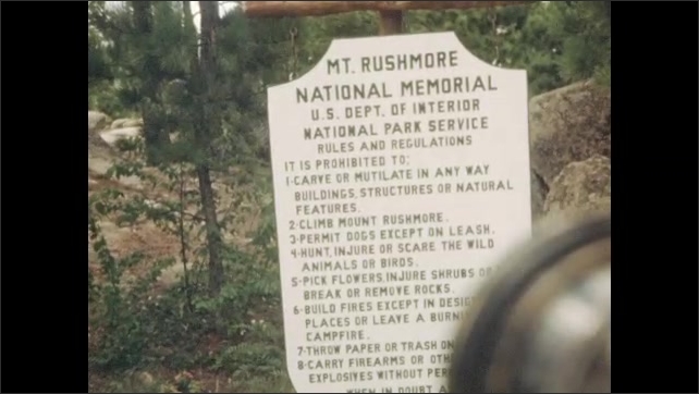1940s: Trees and mountains. Mount Rushmore. Rules sign in park ...