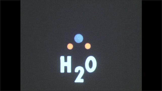 1960s: Two blue dots and a black dot. Diagram of water molecule. Animation of atoms bouncing off ...