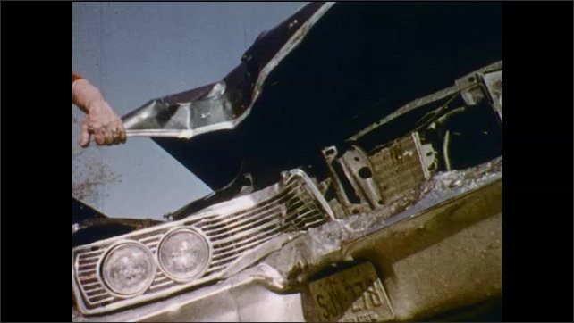 1970s: Sign for insurance office. Firefighters lean out smoking window ...