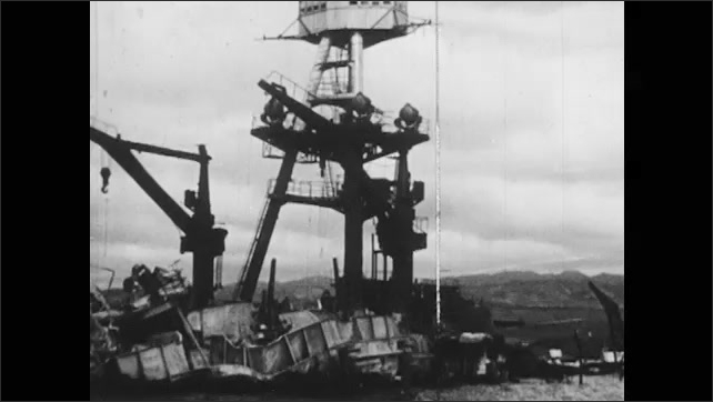 1940s: Wreckage of a battleship sunk in Pearl Harbor. – Archival Footage
