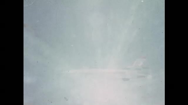 UNITED STATES: 1980s: Two jet planes fly parallel in sky. Jet plane ...