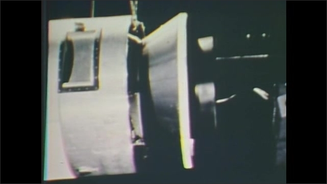1960s: Spacecraft docking simulator in motion. Astronauts sit in ...